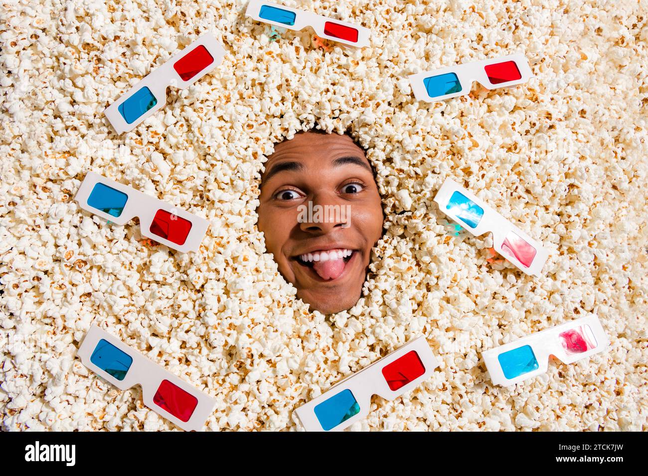 Top view photo of playful carefree guy nerd about watching new film ...