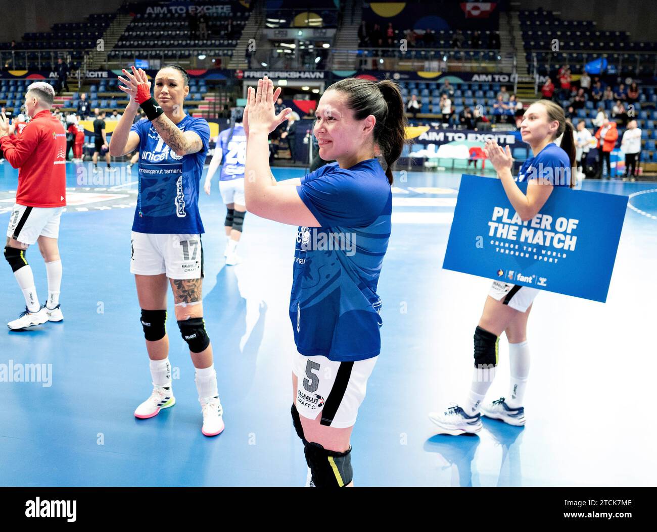 Players from Greenland reacts after losing their match between ...
