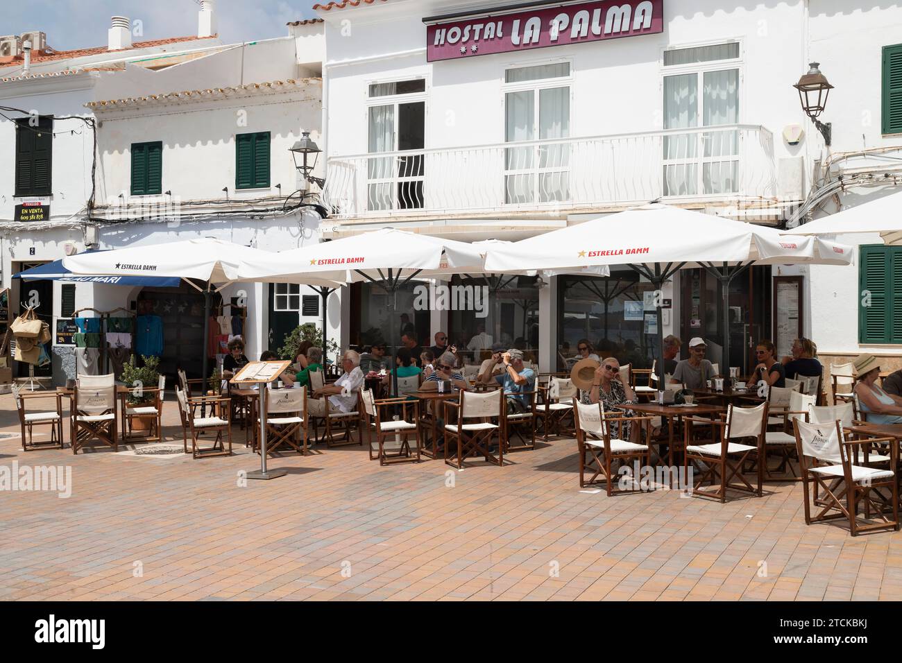 People enjoy the terrace at the front of the guest house in the fishing ...