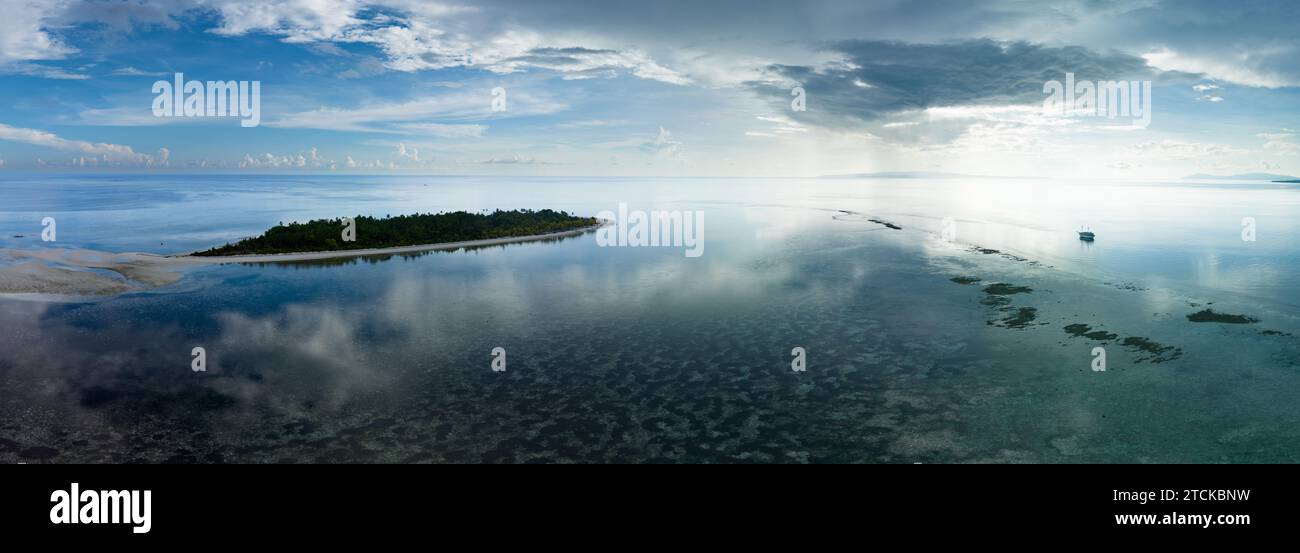 Morning light illuminates the island of Koon in Indonesia. This island ...