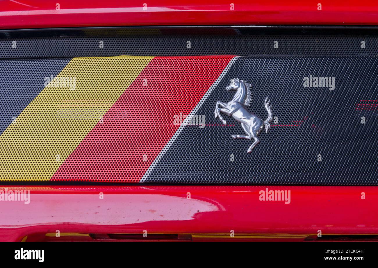 Famous silver Prancing Horse logo on the rear of a red Ferrari sports ...