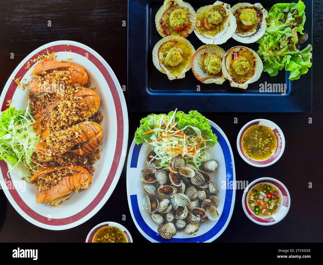 Top view of variety Seafood party table with scallop, cockle, crab ...