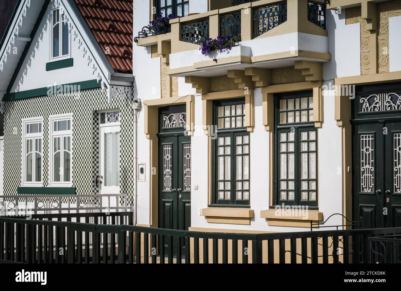 The city street is lined with charming beach houses, each with its own ...