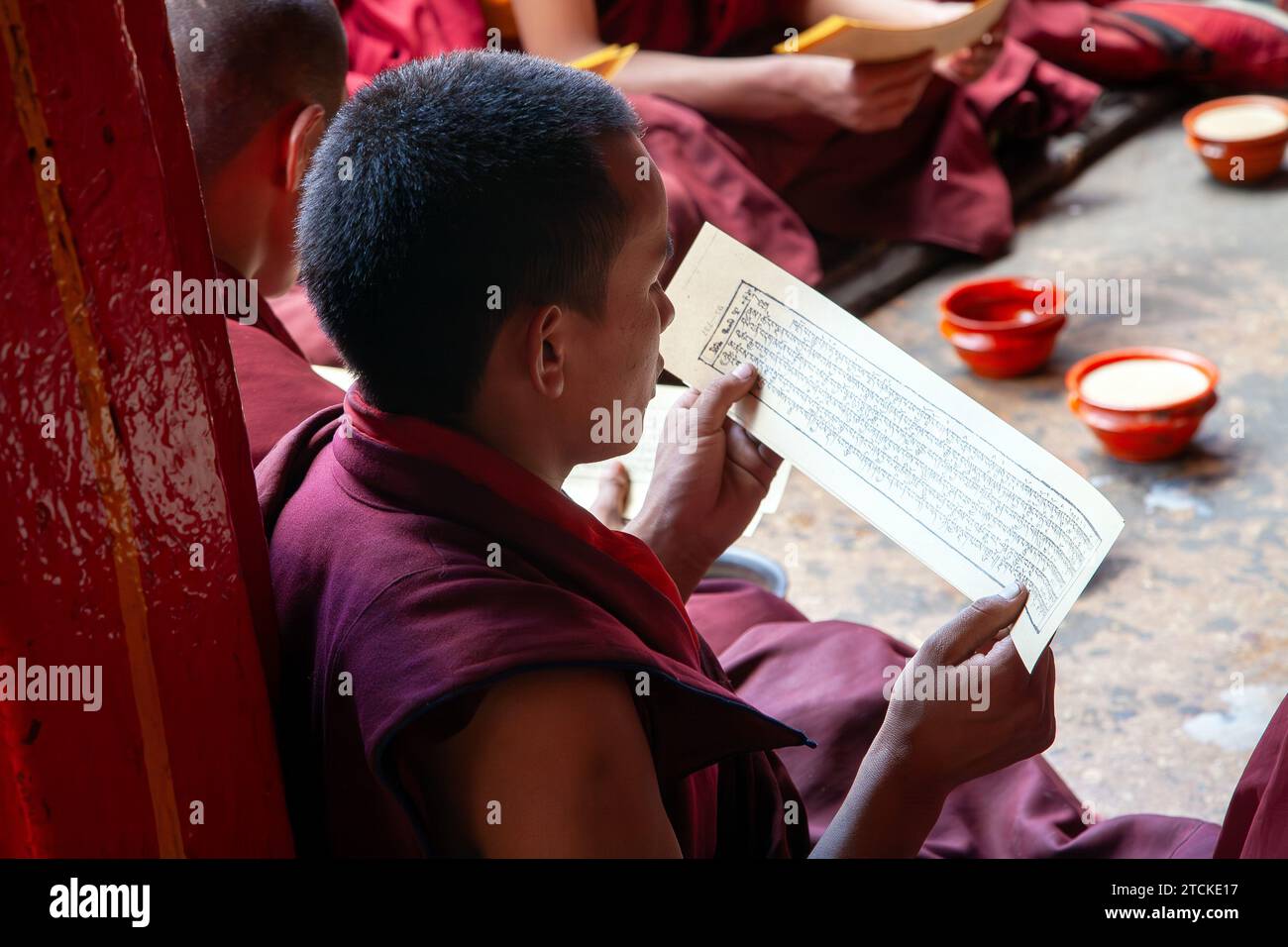 Buddhist monk reading scripture hi-res stock photography and images - Alamy