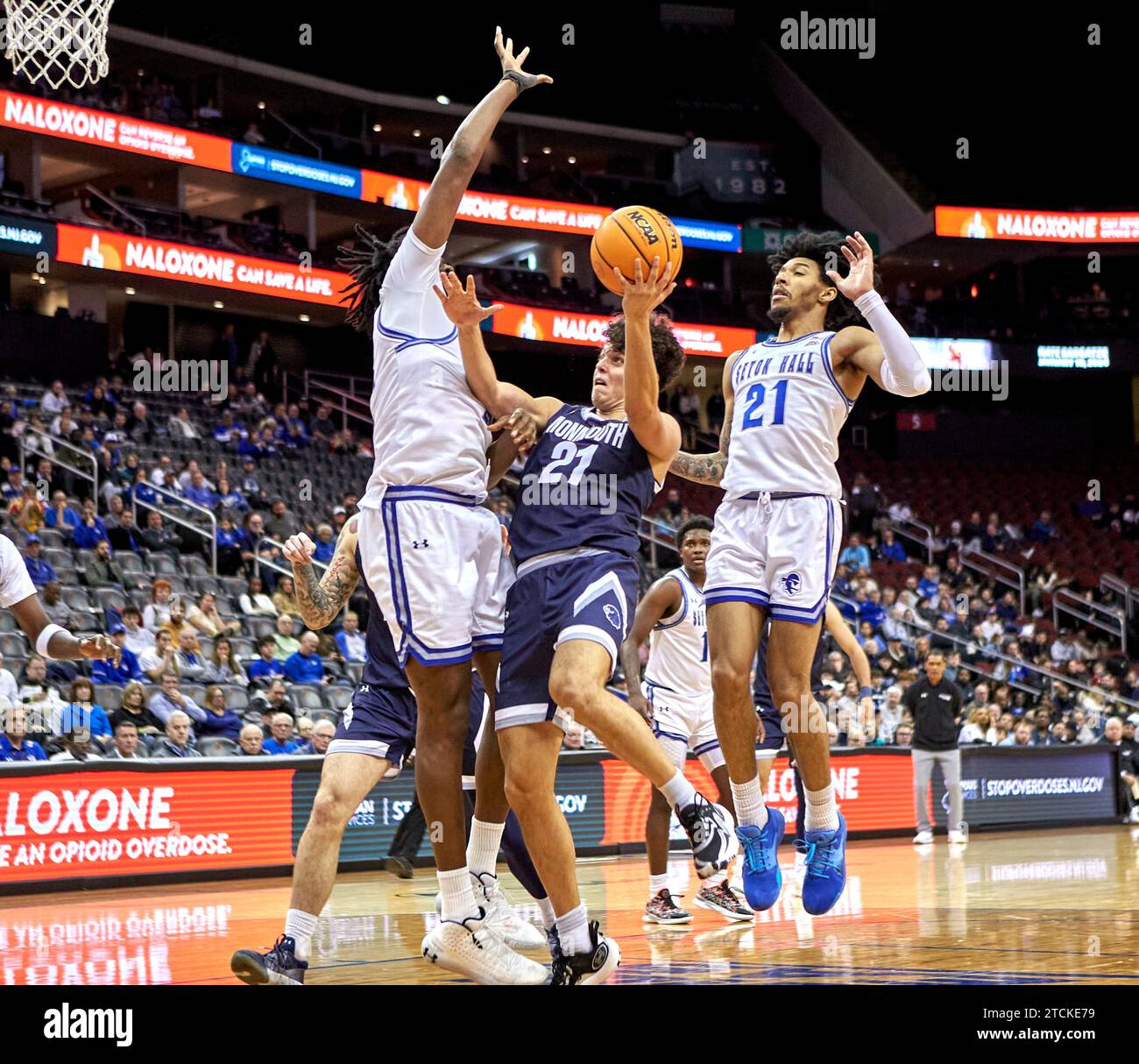 Monmouth Hawks guard Xander Rice (21) ates pressure from Seton Hall ...
