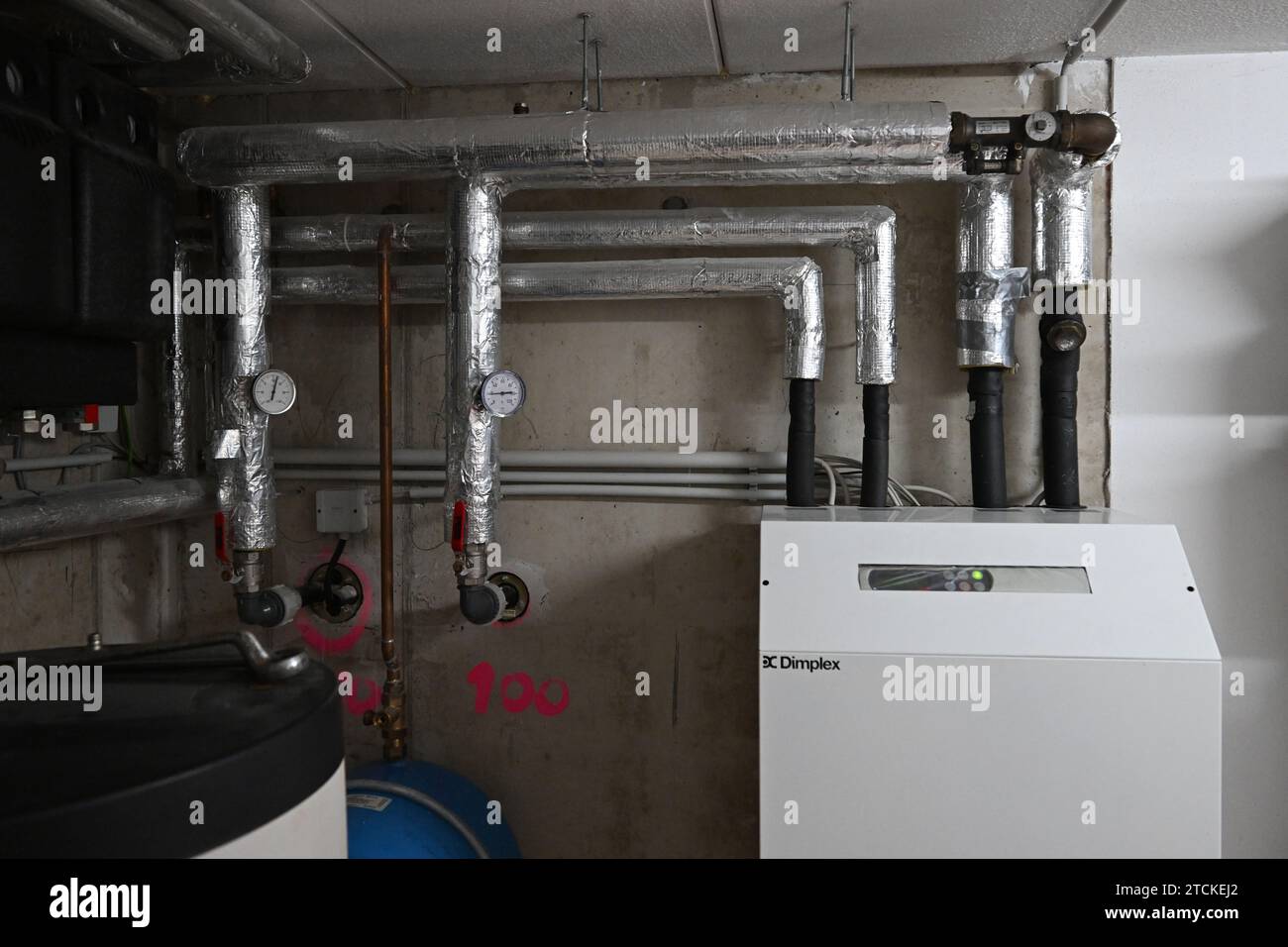 Munich, Germany. 13th Dec, 2023. A water-to-water heat pump with a well ...