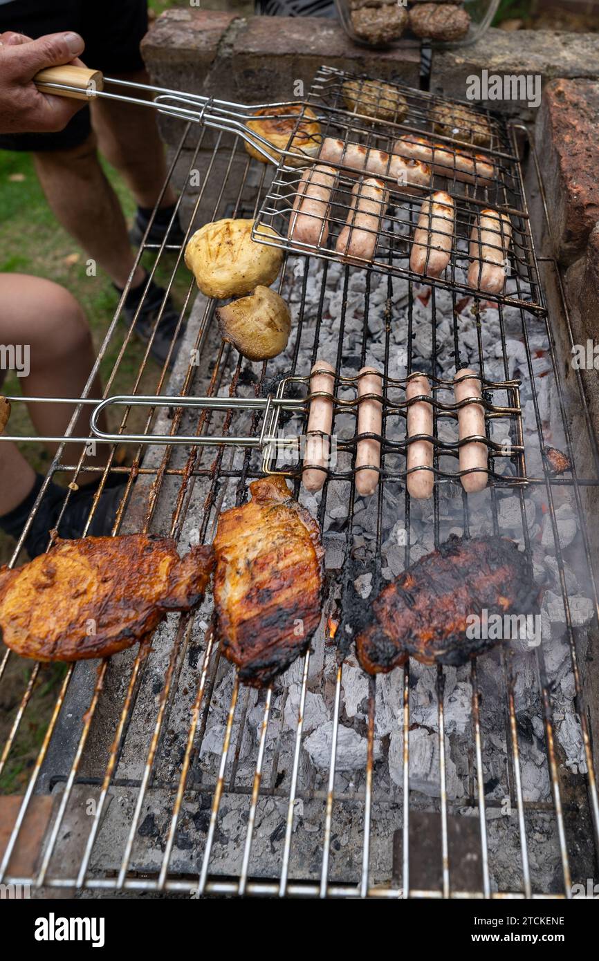 BBQ party, grilled suasage on a bbq trail, open flame Stock Photo - Alamy