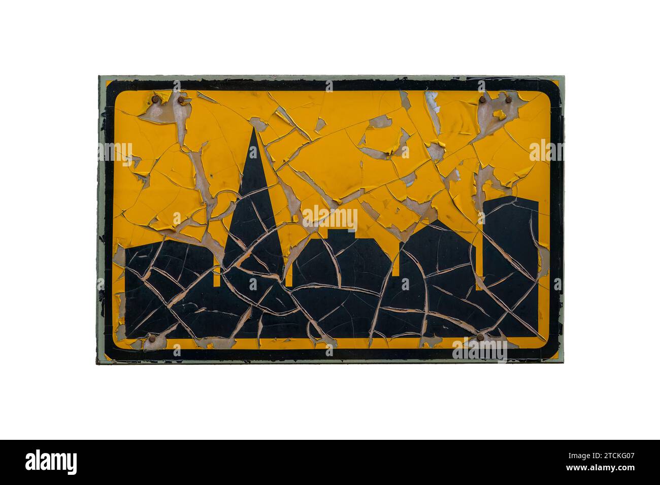 Yellow weathered built up area road sign with paint peeling off ...
