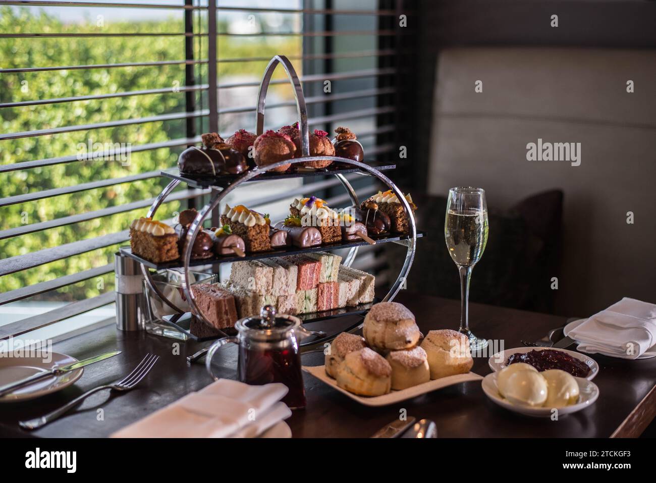 Tea Time in England with Champagne Glass scones and sweets Stock Photo ...