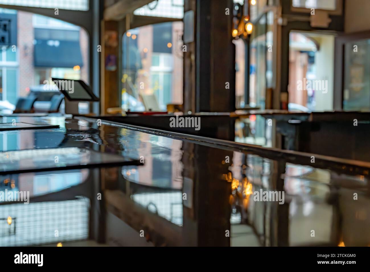 Shiny wooden top of an empty bar during a daytime Stock Photo - Alamy