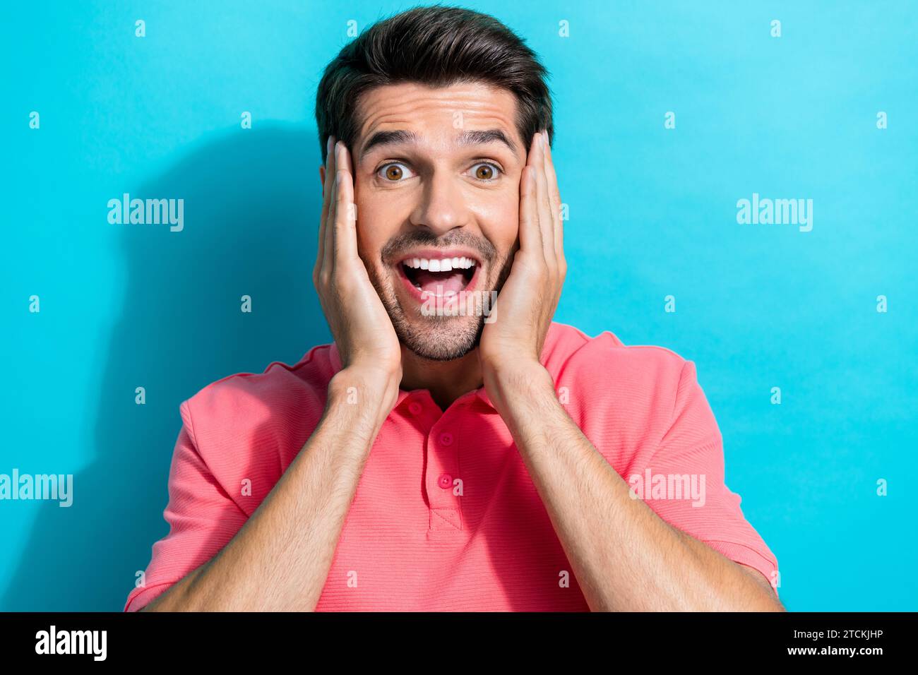 Portrait Of Funny Handsome Young Man Brunet Hair Touch Cheeks Screaming