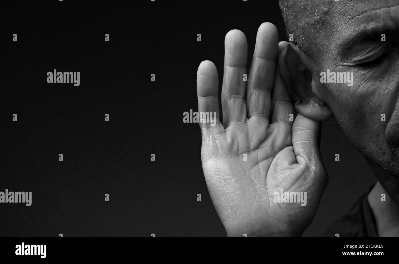 deafness suffering from hearing loss on grey black background with ...