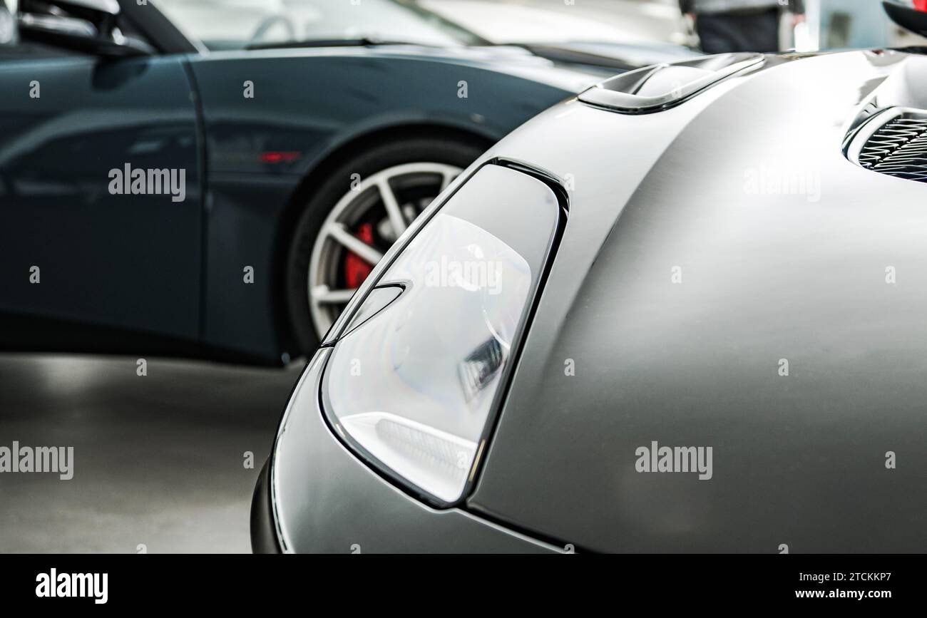 Modern Brand New Luxury Cars Inside a Dealership Showroom. Automotive ...