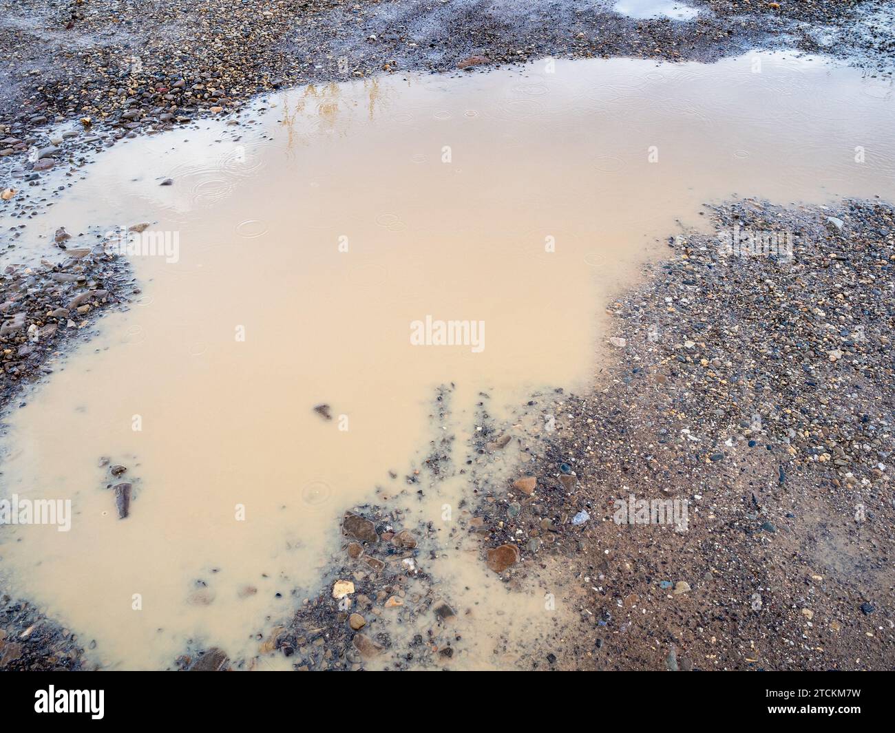 surface of dirty rain puddle on village gravel road on autumn day Stock ...
