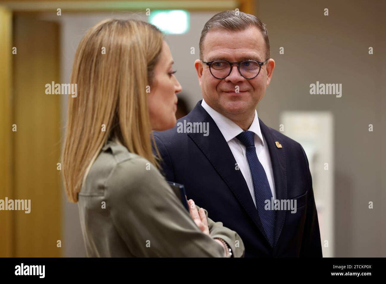 European Parliament President Roberta Metsola, left, speaks with Finland's Prime Minister ...