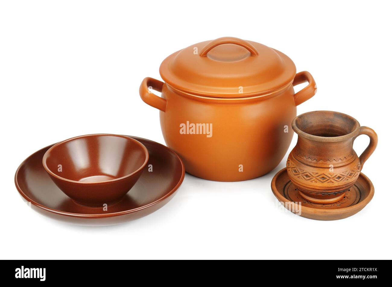 Ceramic pan, set of plates and clay cup isolated on white background ...