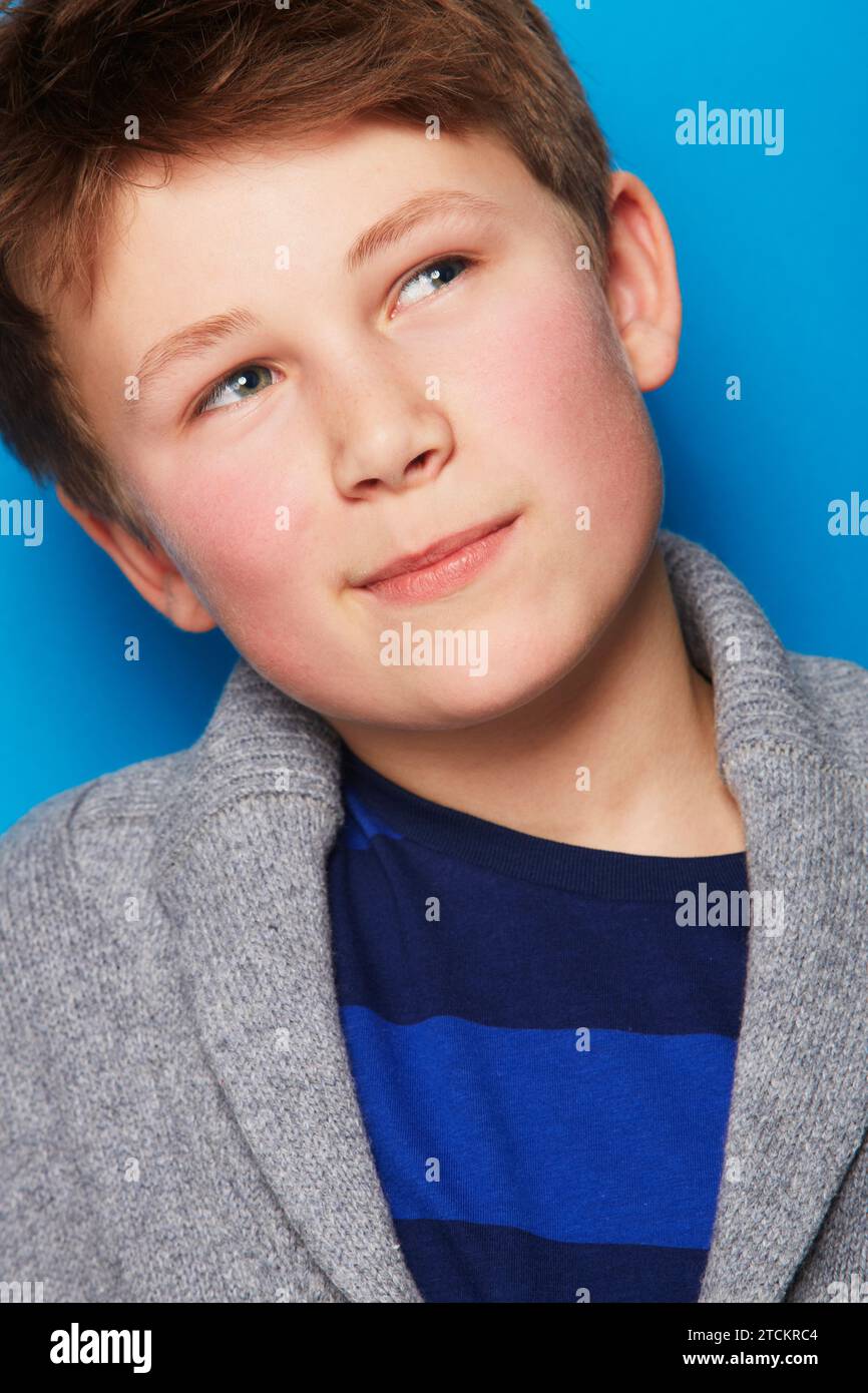 Thinking, idea and boy child in studio with planning, dream or ...