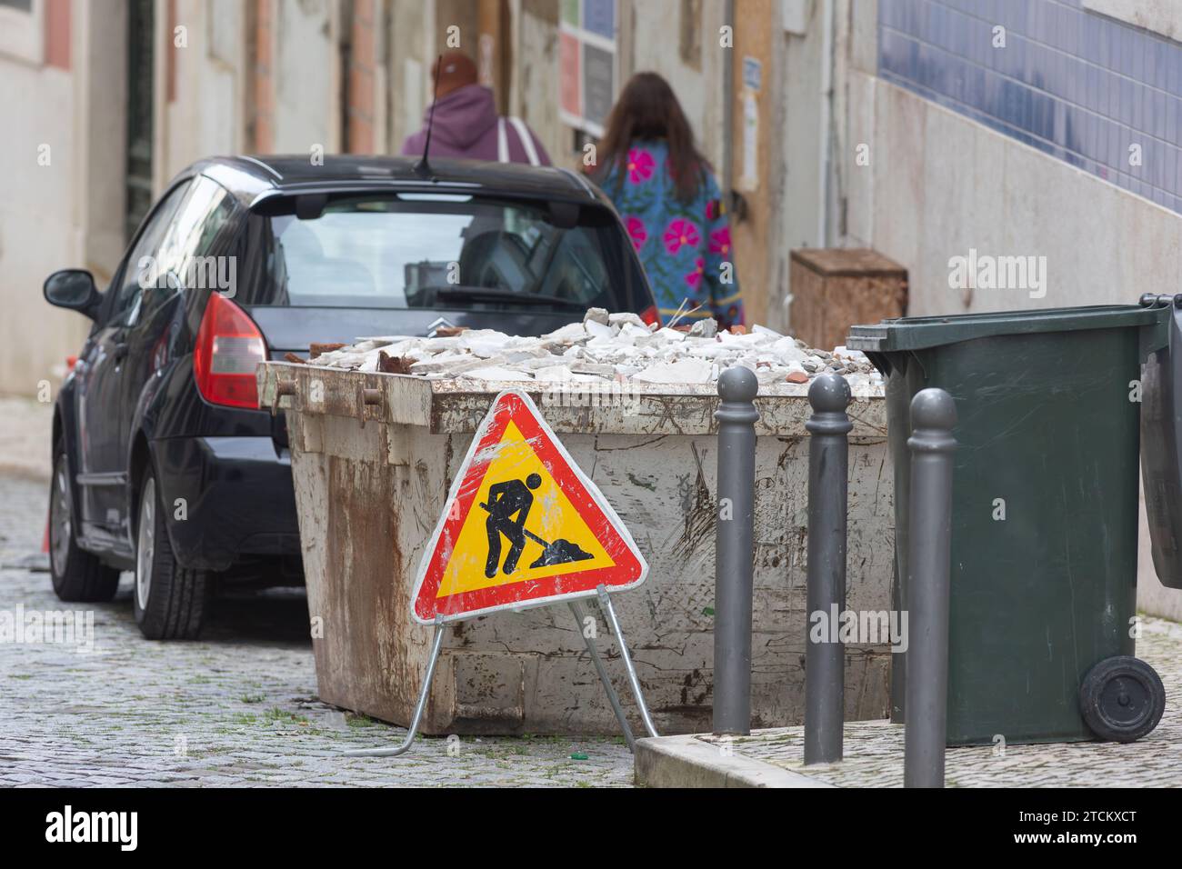 Construction trash container on the street Stock Photo - Alamy