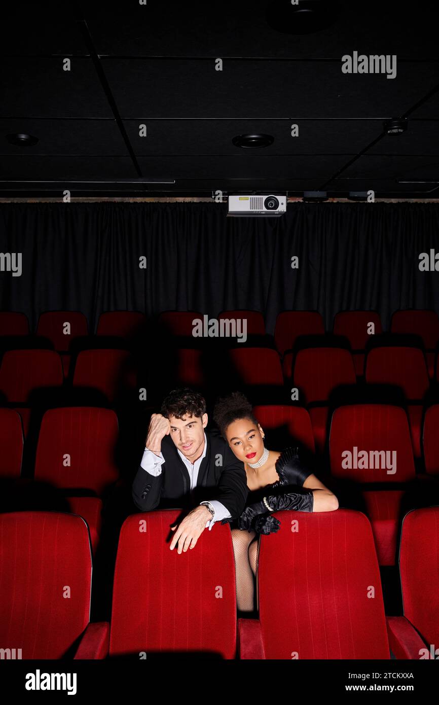 Black couple sitting red hi-res stock photography and images - Alamy