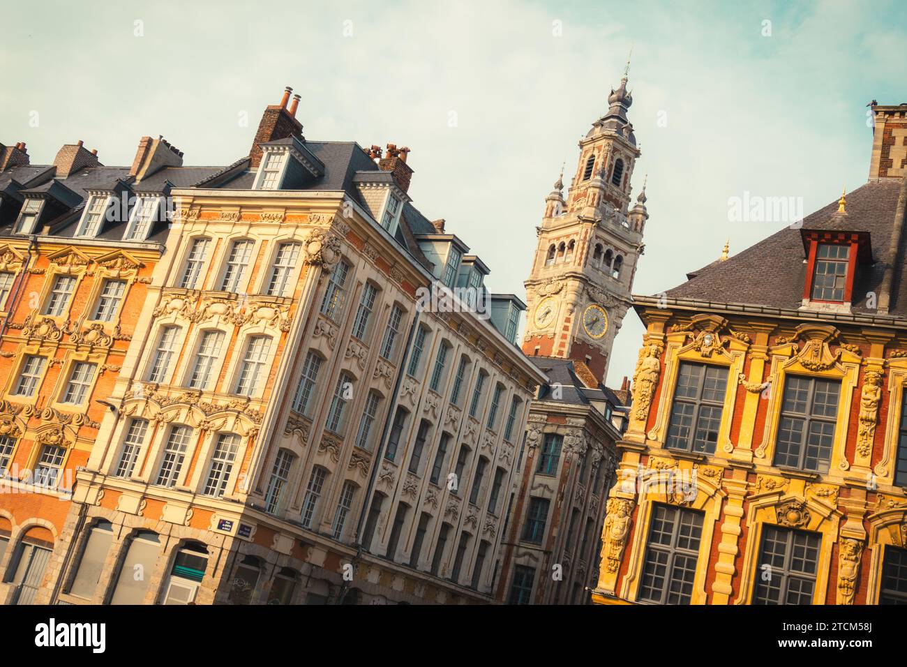 Antique renaissance buildings and the belfry of the Chamber of Commerce ...