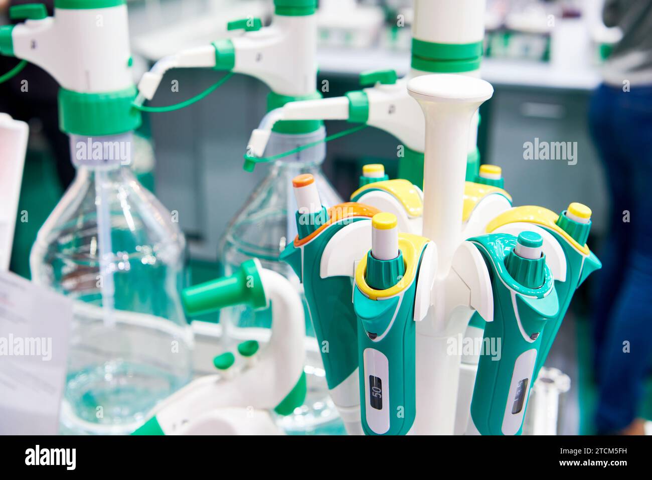 Chemical dispensers on a carousel stand Stock Photo - Alamy