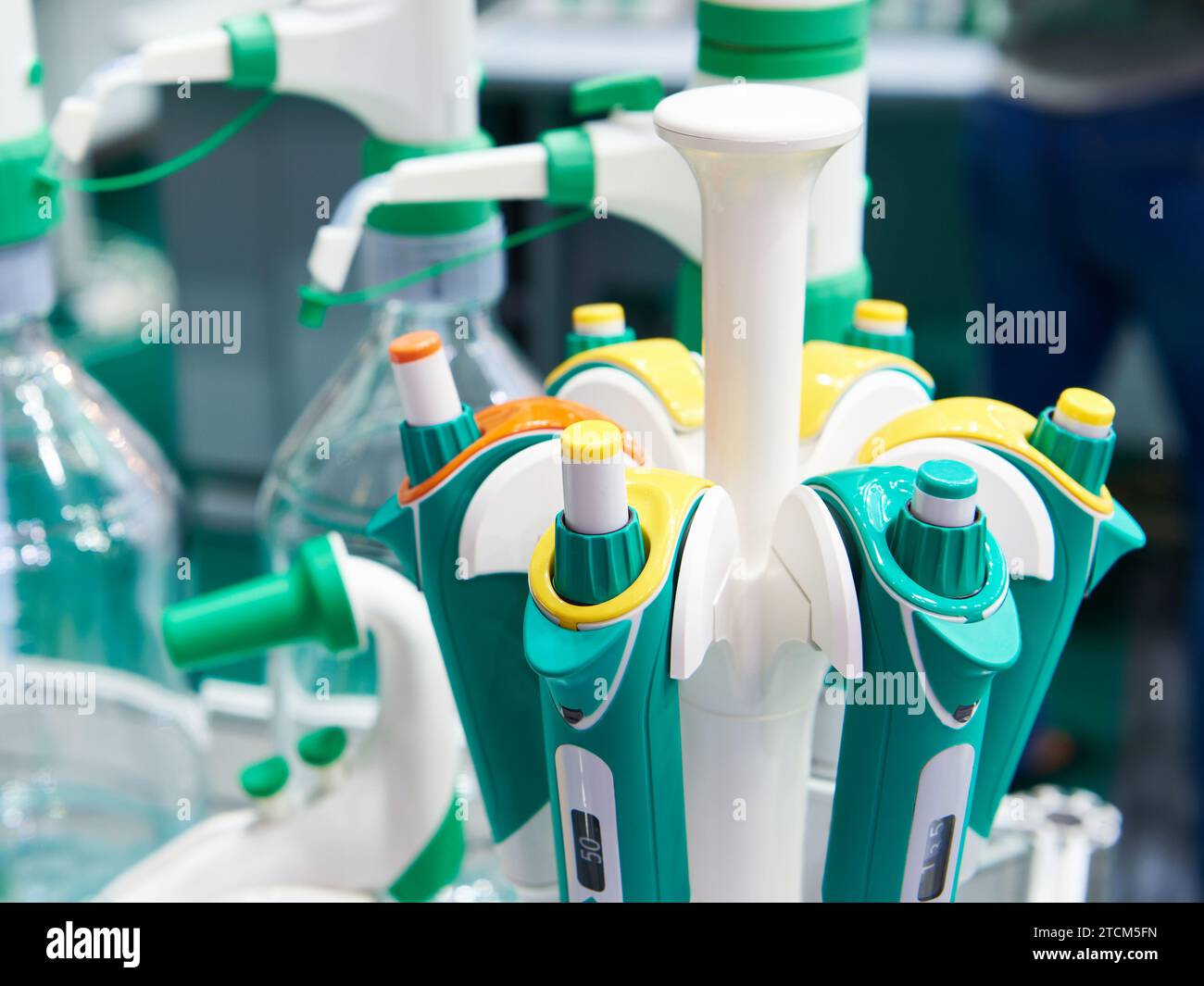 Chemical dispensers on a carousel stand Stock Photo - Alamy