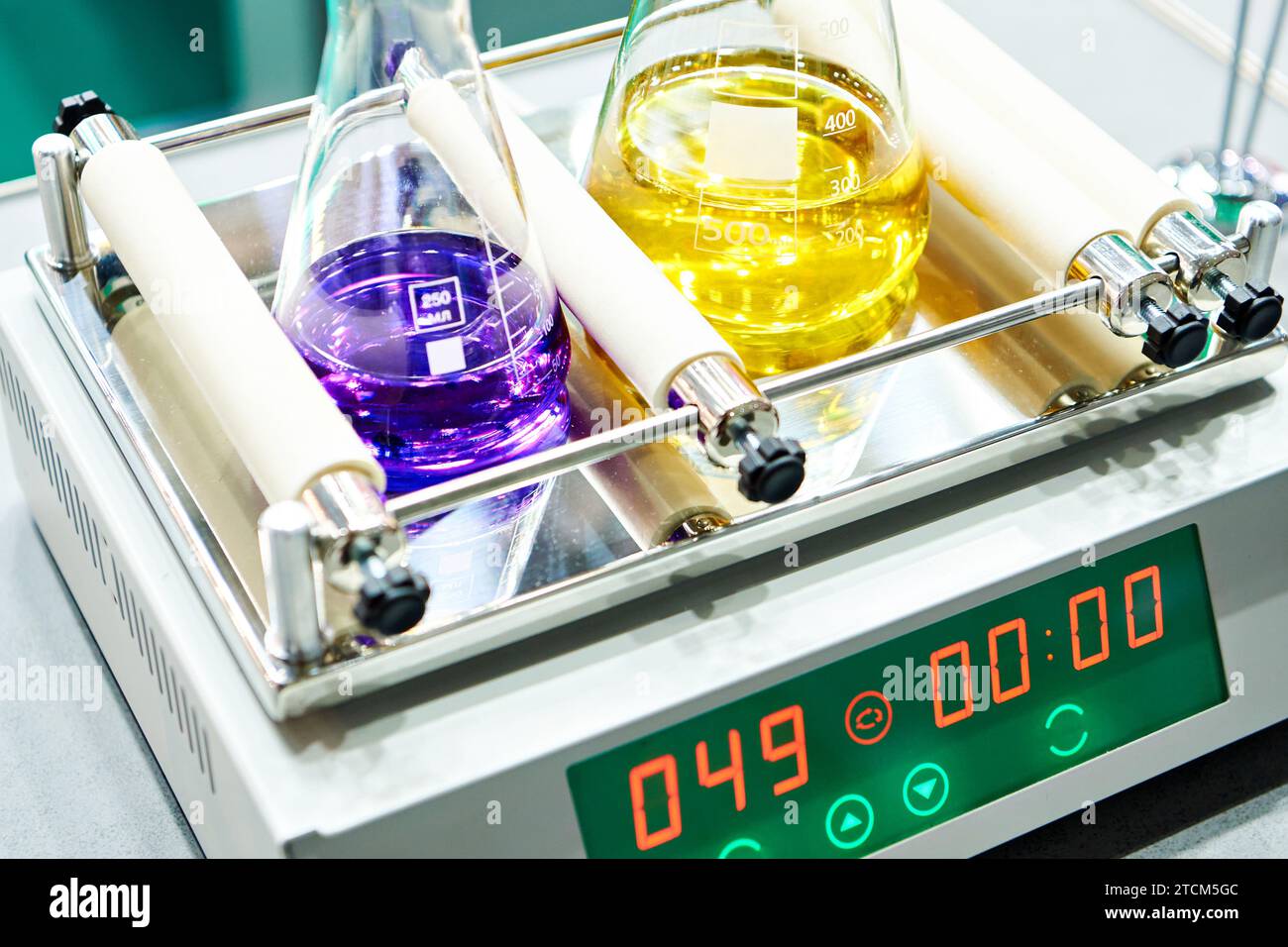 Laboratory shaker and flasks with solution Stock Photo - Alamy