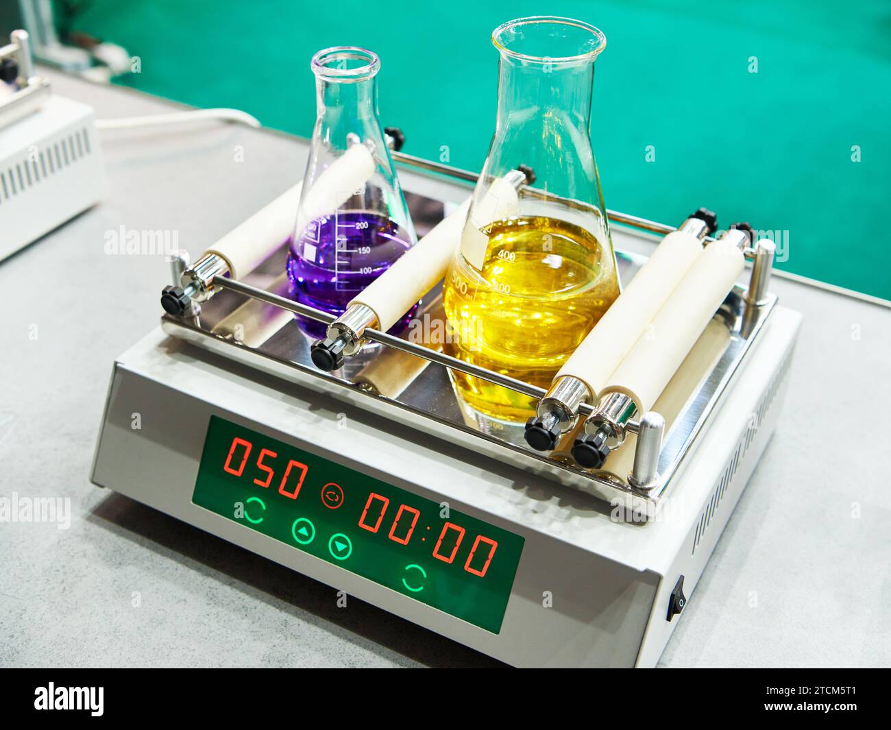 Laboratory shaker and flasks with solution Stock Photo - Alamy