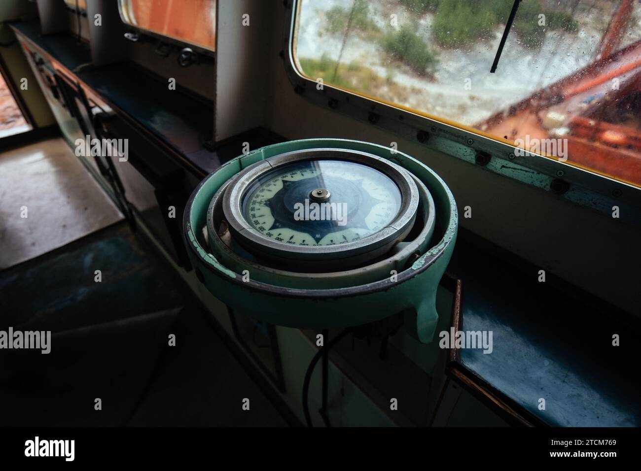 Old compass in abandoned ship Stock Photo - Alamy