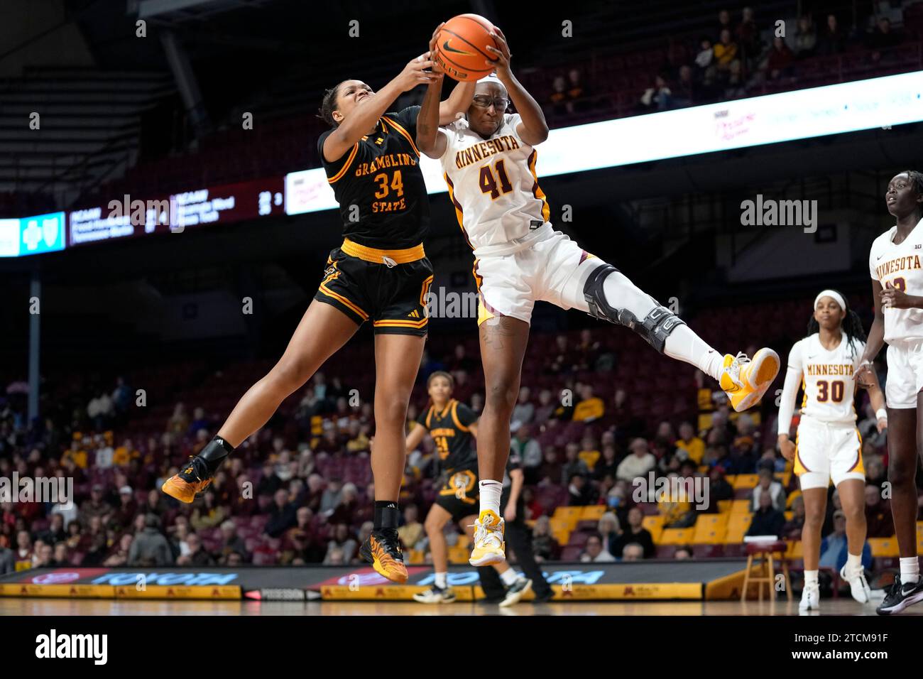 Grambling State center Amanda Blake (34) and Minnesota forward Niamya ...