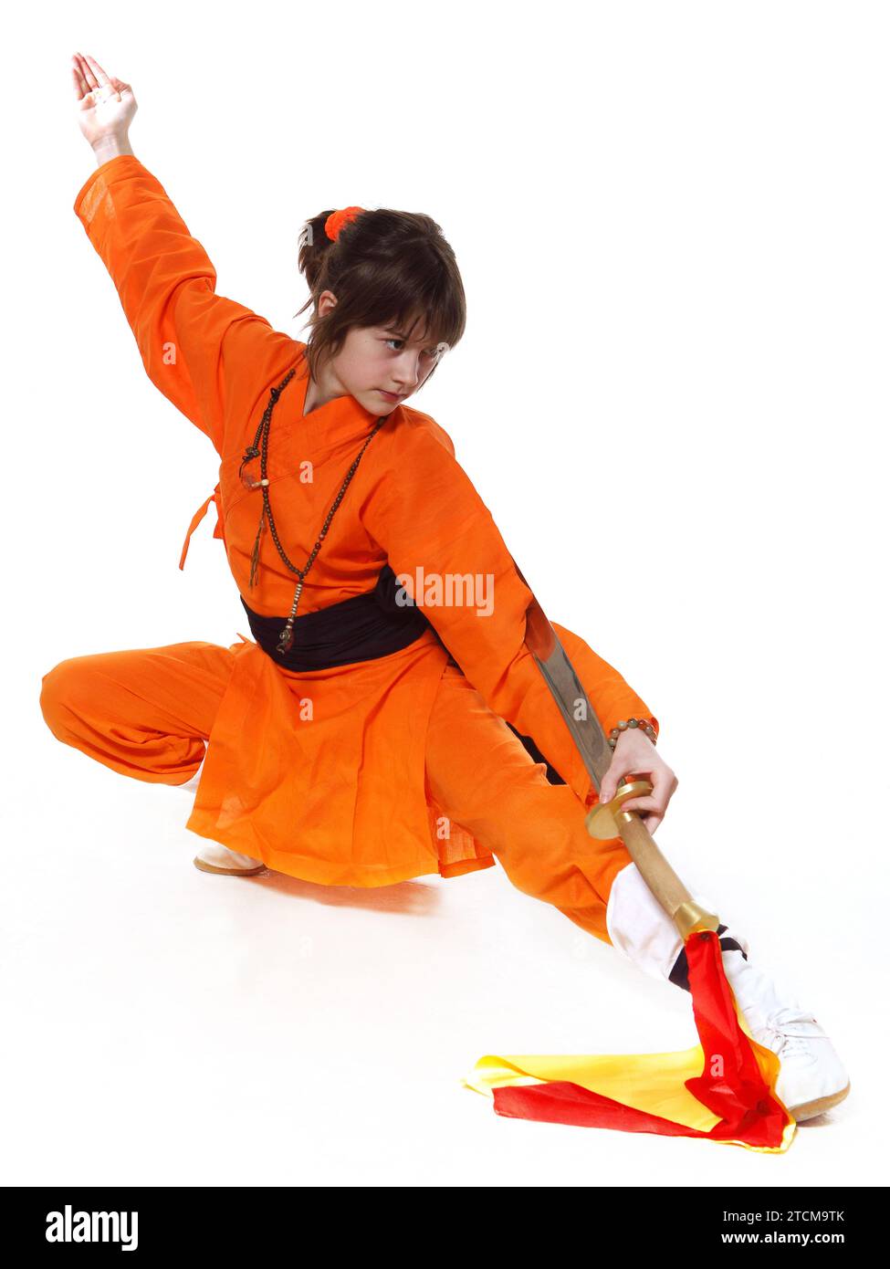 Wushu-Girl dressed in orange make exercise of Shaolin taolu Stock Photo ...