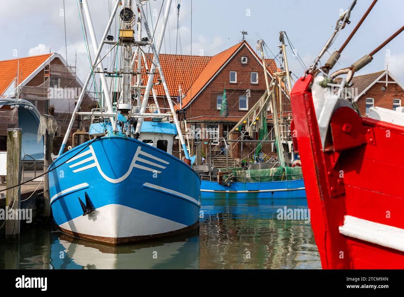 Colorful traditional old german fishing cutter boats moored ...