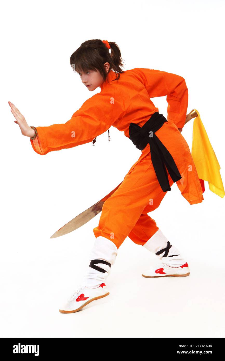 Wushu-Girl dressed in orange make exercise of Shaolin taolu Stock Photo ...