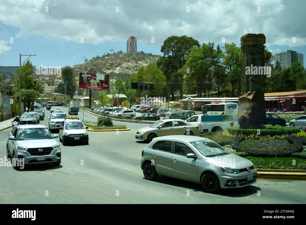 Traffic in La Paz with the cable car in the background. La Paz, Bolivia ...