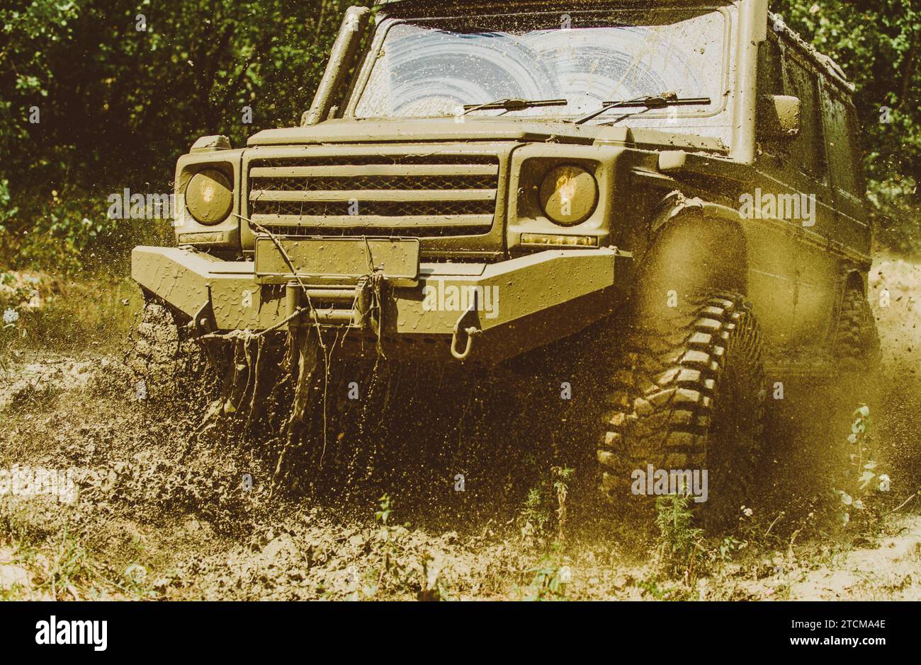 Best Off Road Vehicles. Mud and water splash in off-road racing. Tracks ...