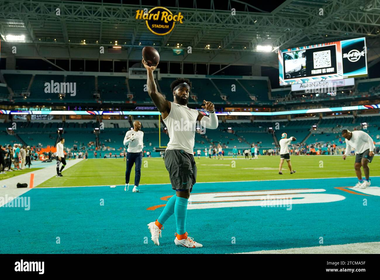 Miami Dolphins linebacker David Long Jr. throws a football to fans ...