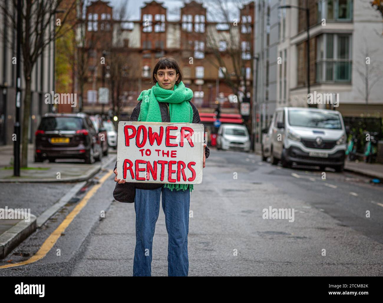 Female protester holding sign power to the renters in London , UK Stock ...