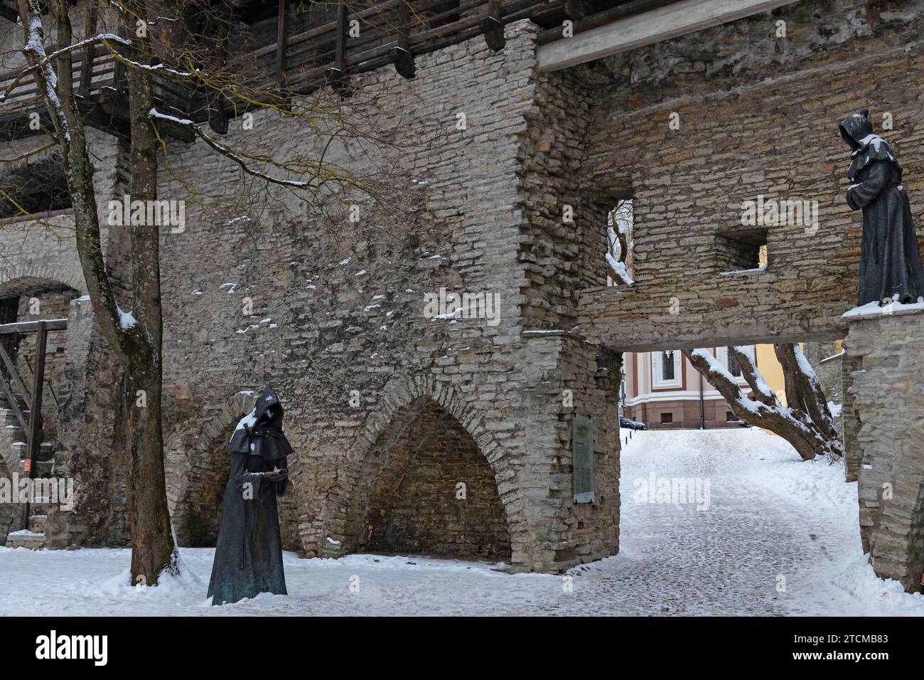 medieval gate and monk statues in Tallinn in winter Stock Photo - Alamy