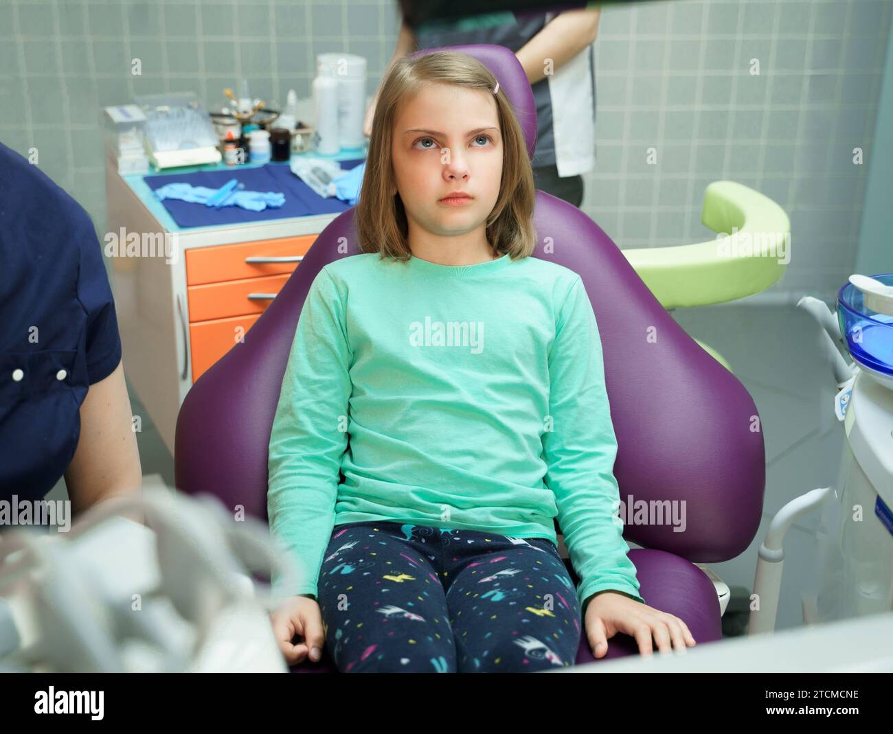 Little scared girl sitting in chair in dentist doctor office. Kid,child ...