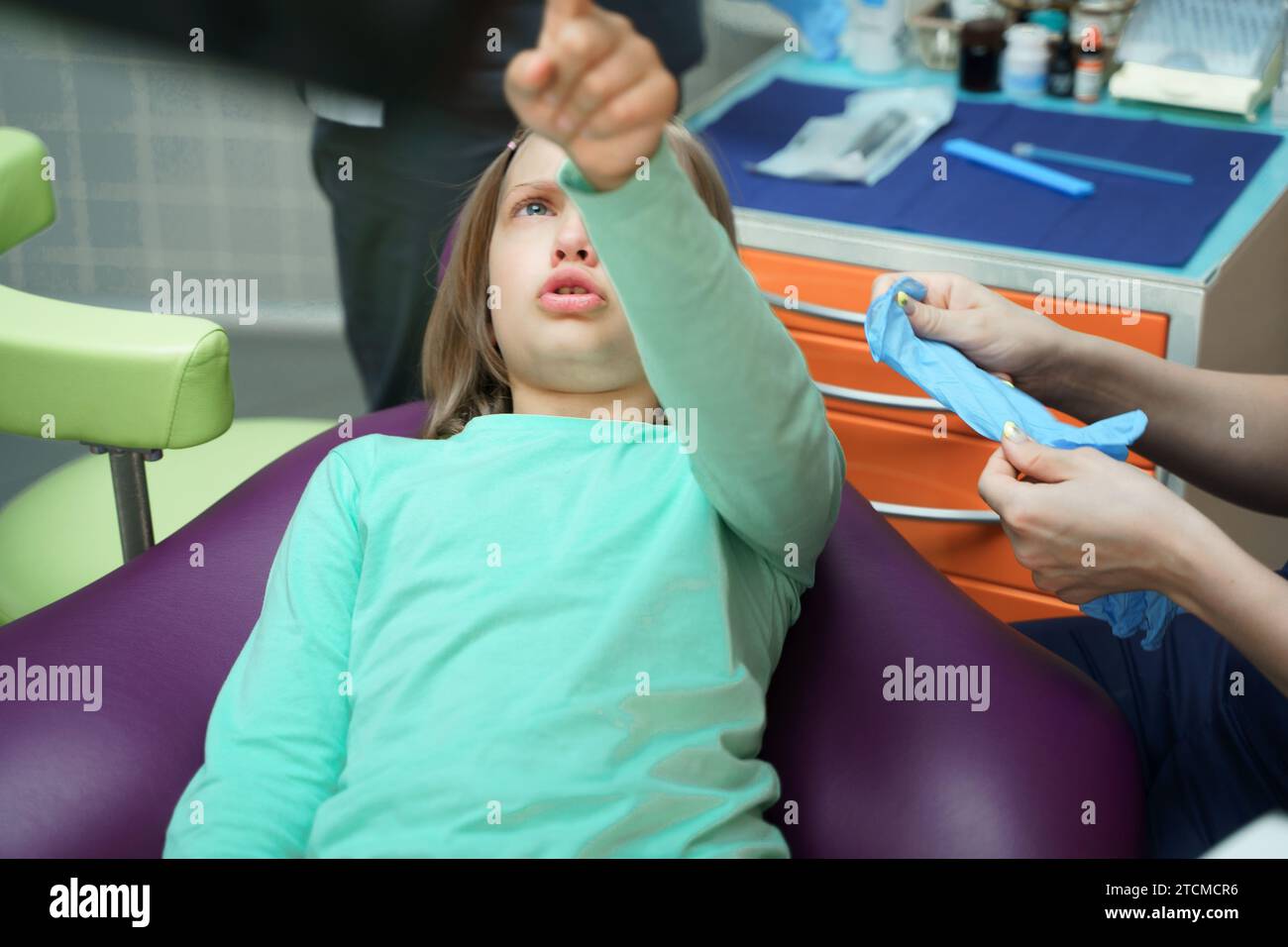 Little scared girl sitting in chair in dentist doctor office. Kid,child ...