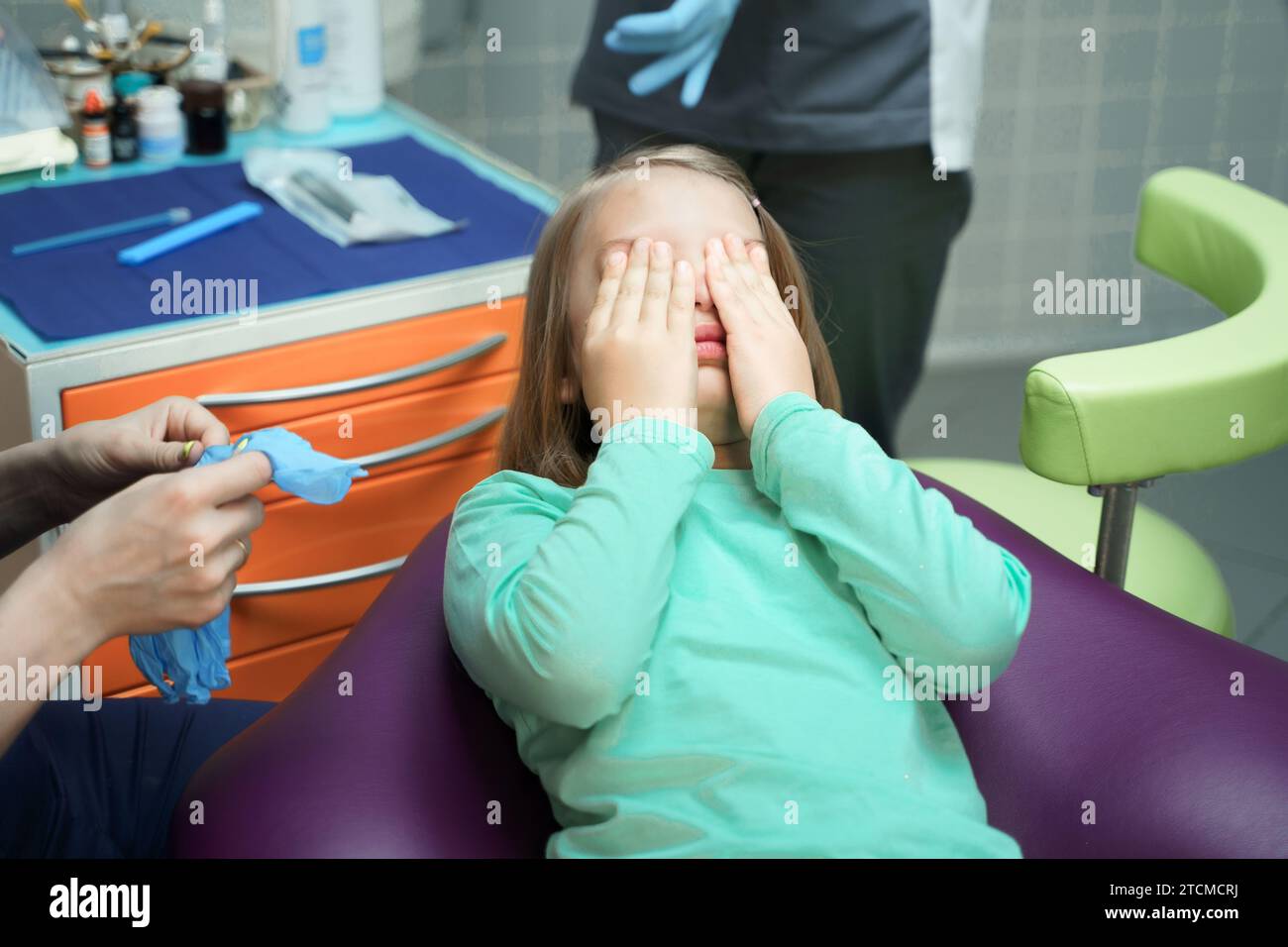 Little scared girl sitting in chair in dentist doctor office. Kid,child ...