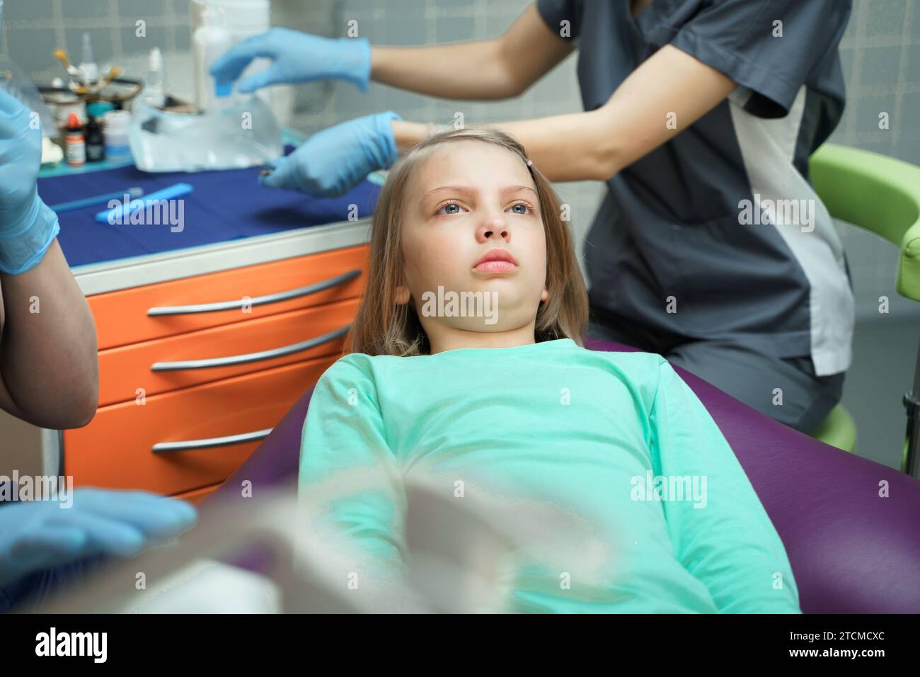 Little scared girl sitting in chair in dentist doctor office. Kid,child ...