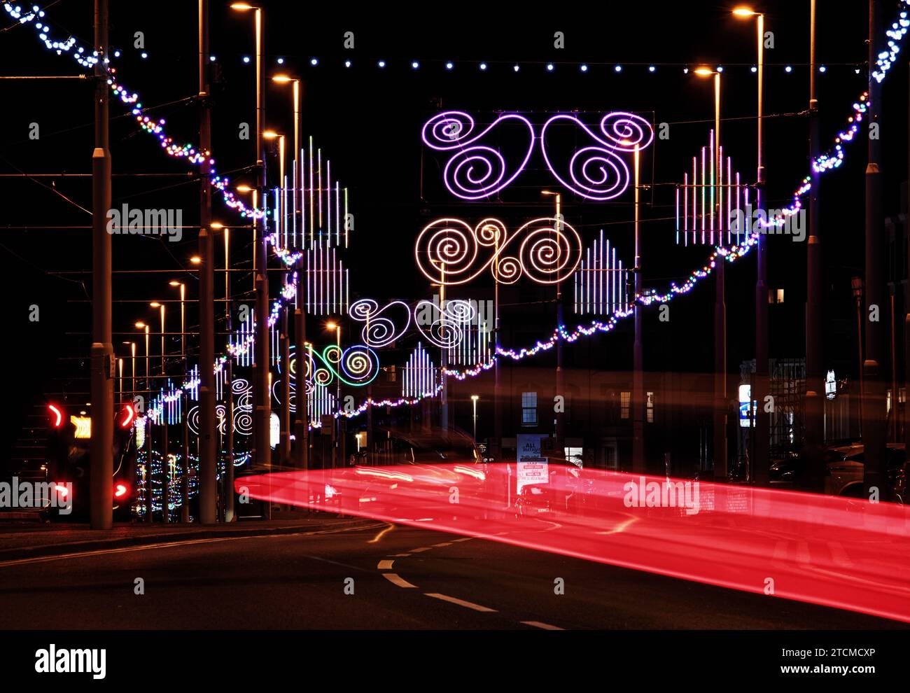 The concept of travelling through Blackpool illuminations, with a red ...