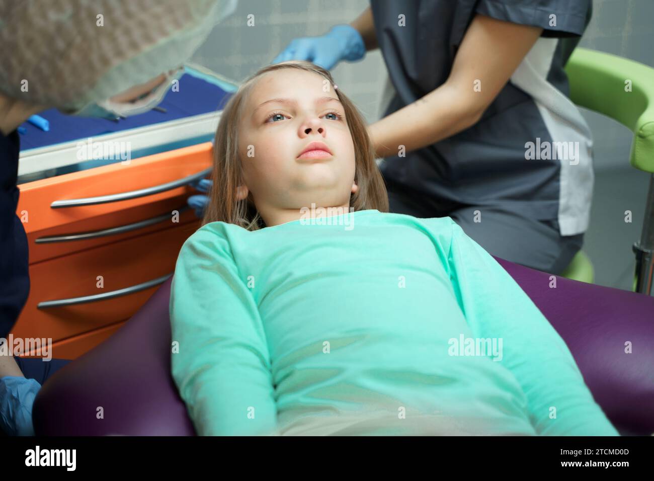 Little scared girl sitting in chair in dentist doctor office. Kid,child ...