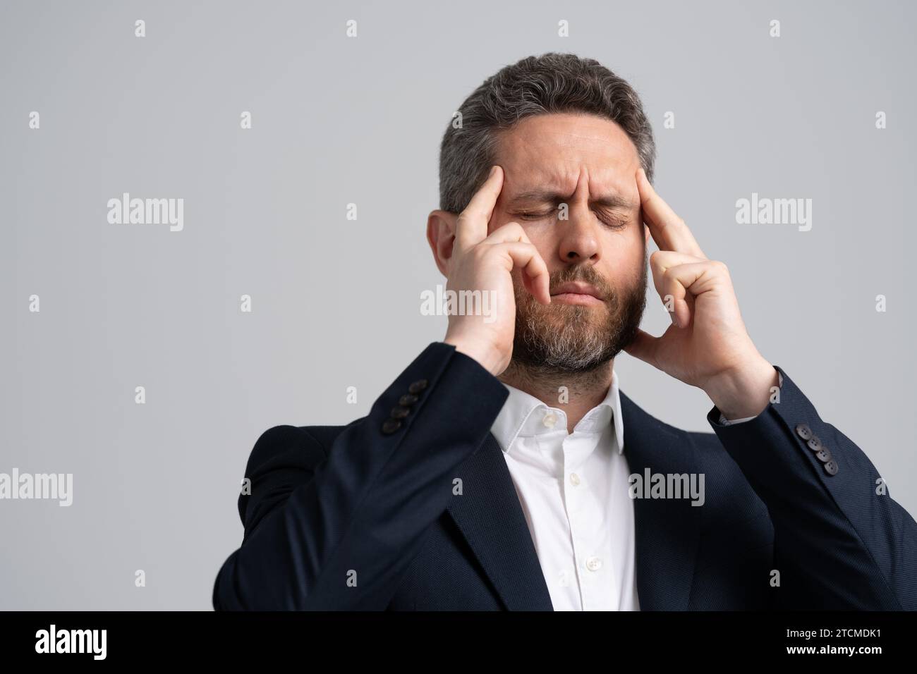 Businessman with stress and burnout. Business man got migraine touch head because of pain ...