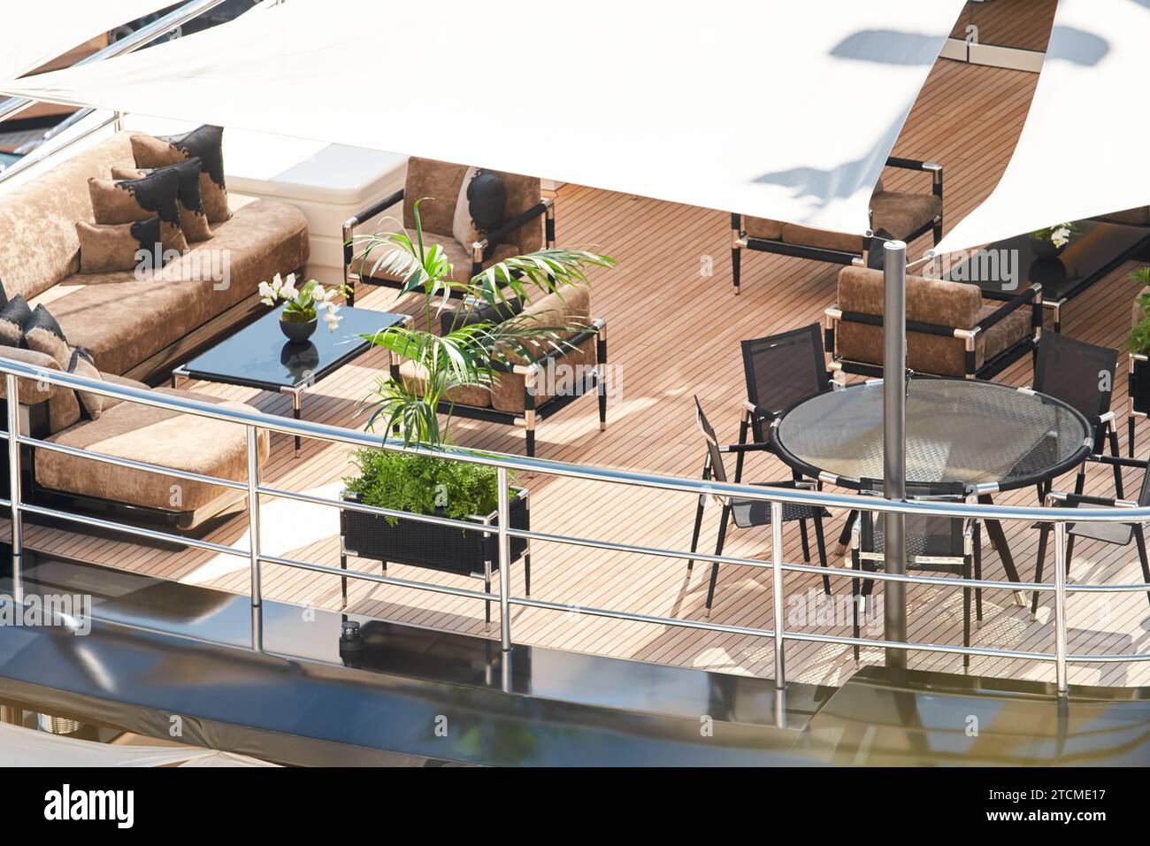 Close up footage of a relaxation area on the open teak deck of an ...