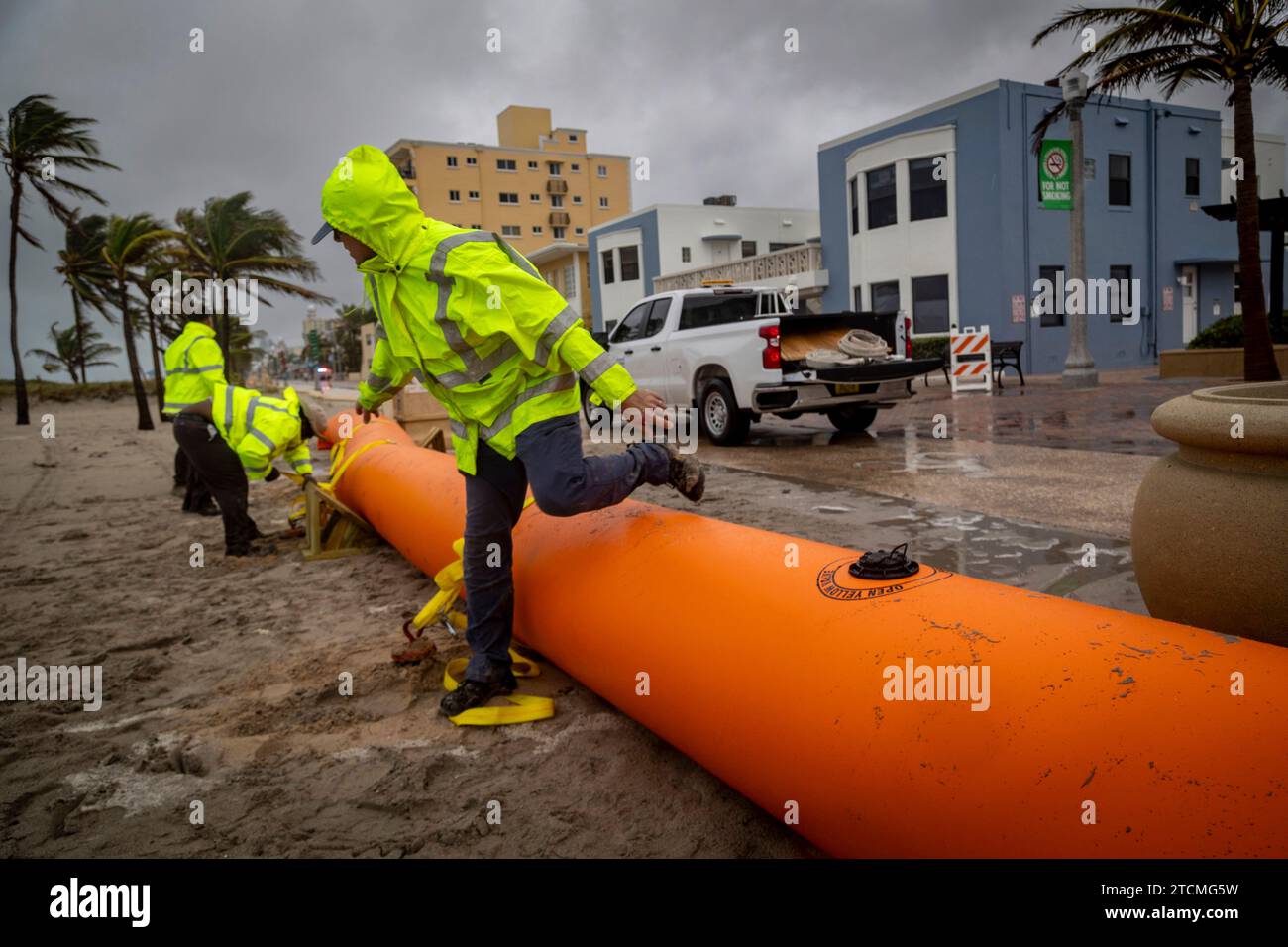 A worker for the City of Hollywood steps over a newly installed Tiger ...