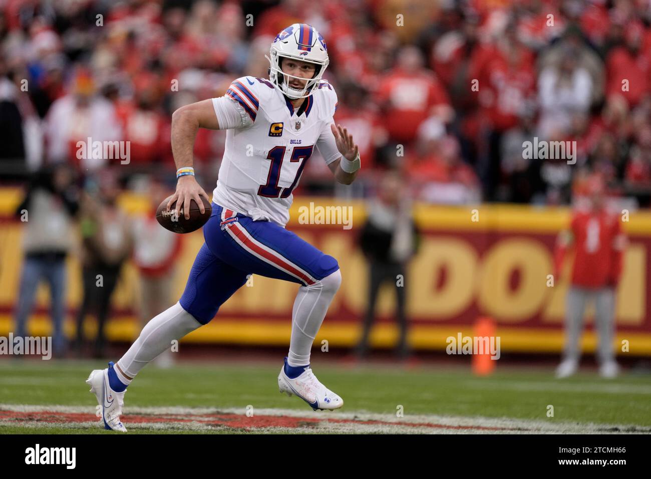 Buffalo Bills quarterback Josh Allen runs the ball during the first half of an NFL football game ...