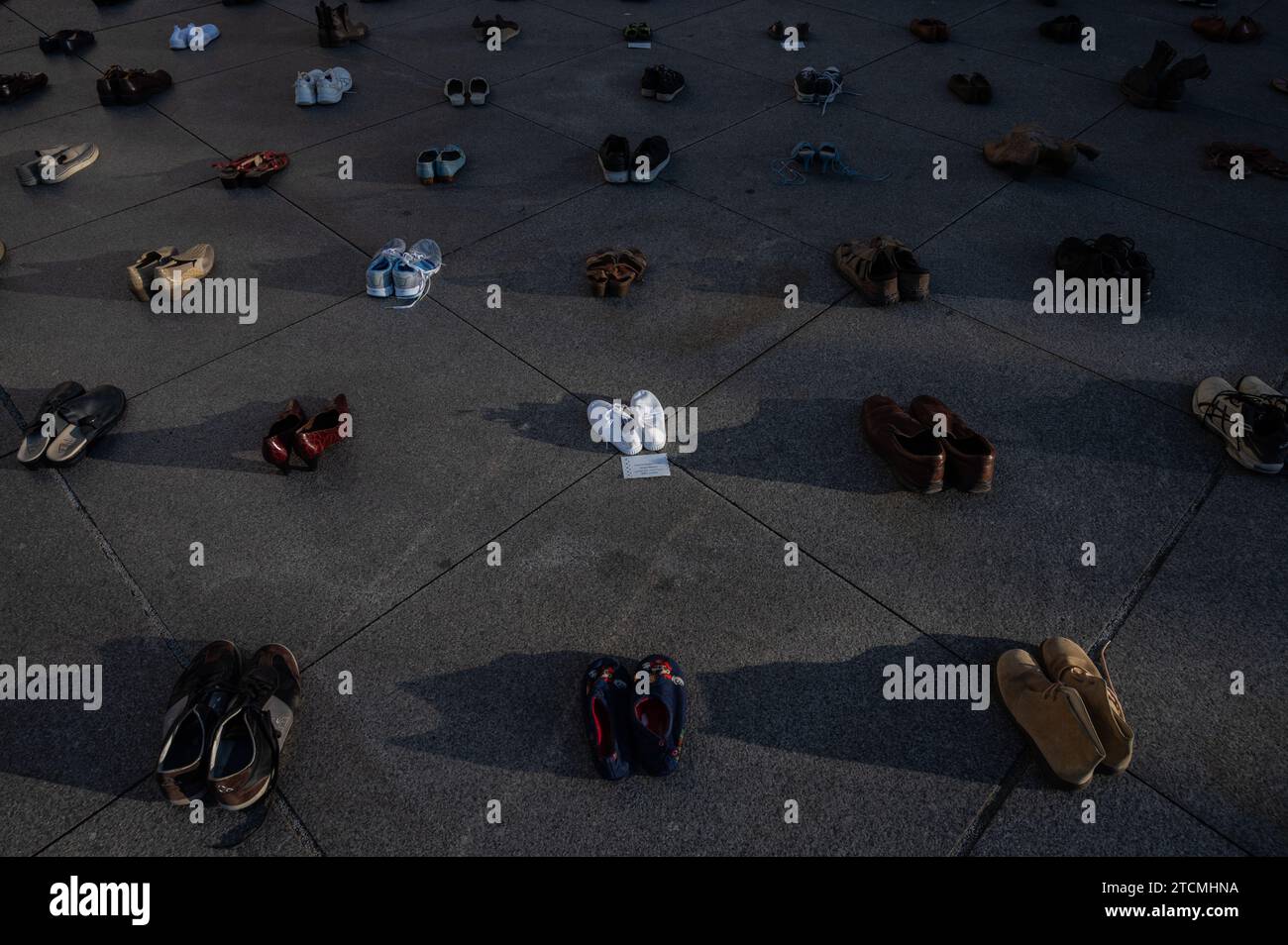 Madrid, Spain. 13th Dec, 2023. Shoes lay on the ground during a protest ...