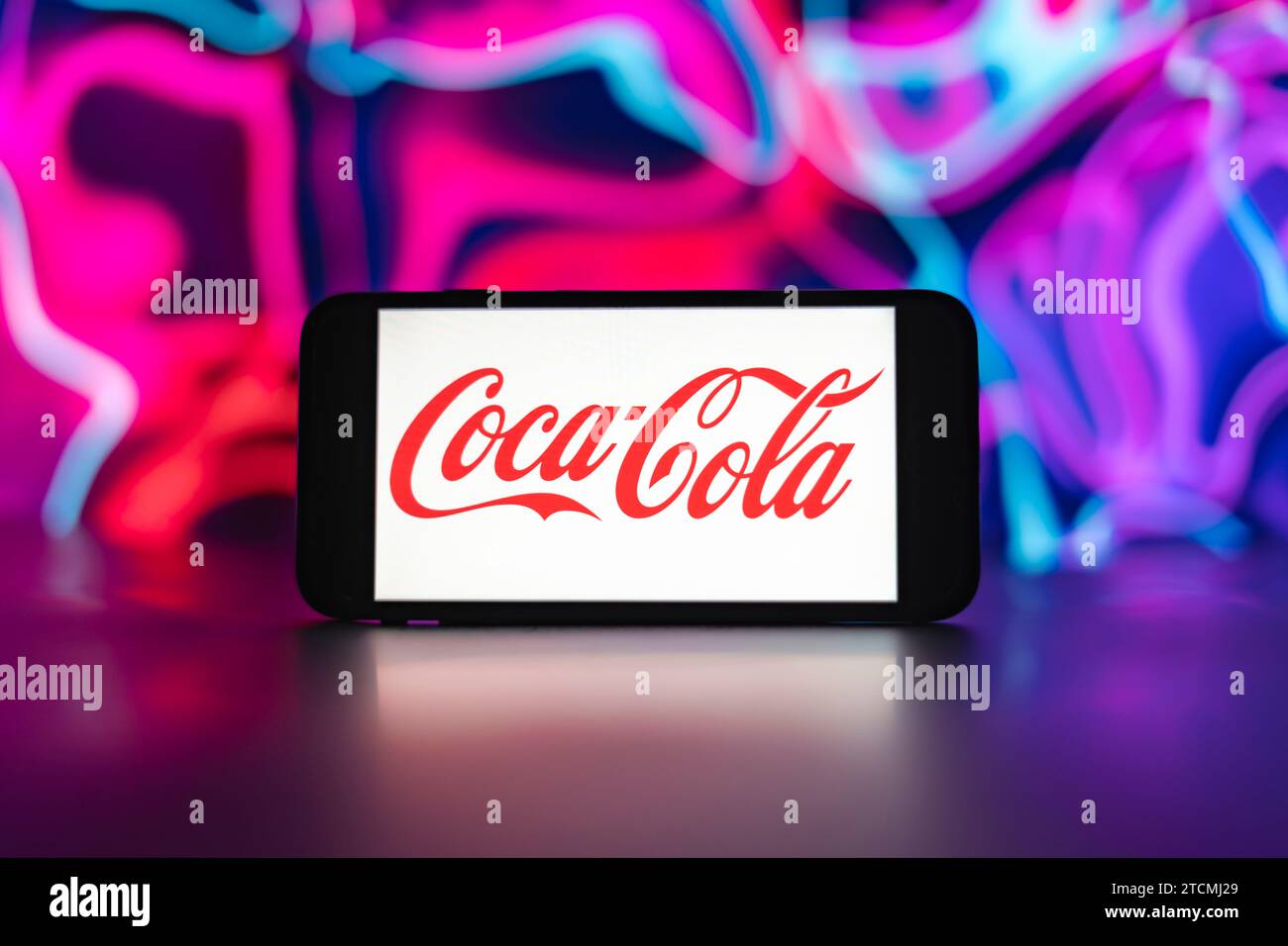 In this photo illustration, the Coca-Cola logo is seen displayed on a ...